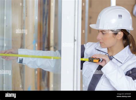 Female Construction Installing Window I Stock Photo Alamy