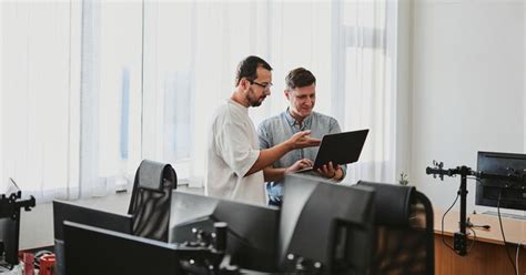 Premium Photo Portrait Of Two Professional Male Programmers Working On Computer In Diverse