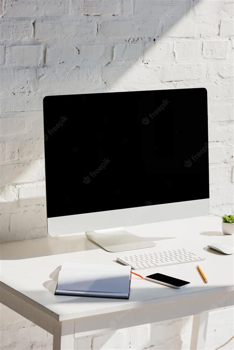 Premium Photo Home Office With Computer Monitor Keyboard And Mouse On Table With Smartphone