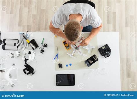 Man Testing Electric Current Of Drone Using Multimeter Tool Stock Photo Image Of Component