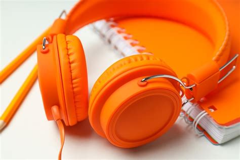 Premium Photo Ontop Large Bright Orange Headphones On A Light Background