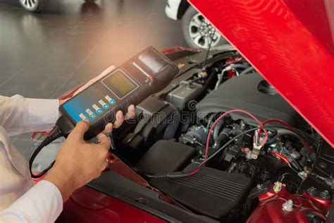Man Inspection Holding Battery Capacity Tester Voltmeter For Service Stock Image Image Of