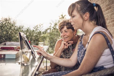 Mother And Daughter Looking At Tablet Stock Image F010 2623 Science Photo Library
