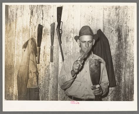 Emil Kimball Sharpening A Sugar Cane Knife He Will Participate In The Tenant Purchase Program