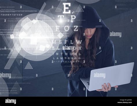 Woman Hacker Using A Laptop In Front Of 3d Digital Background Stock