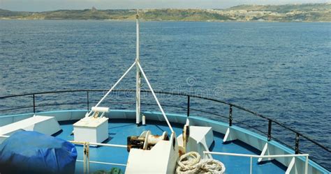 Small Ferry Sails Slowly Across Mediterranean Sea Towards Island Of