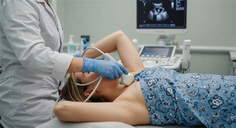Woman In Her 30s Undergoing Thyroid Ultrasound Scan In A Medical Clinic