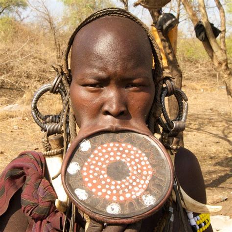 Mursi Women Wear A Clay Plate Through Their Lower Lip And Earlobes Ethiopia Tribal African