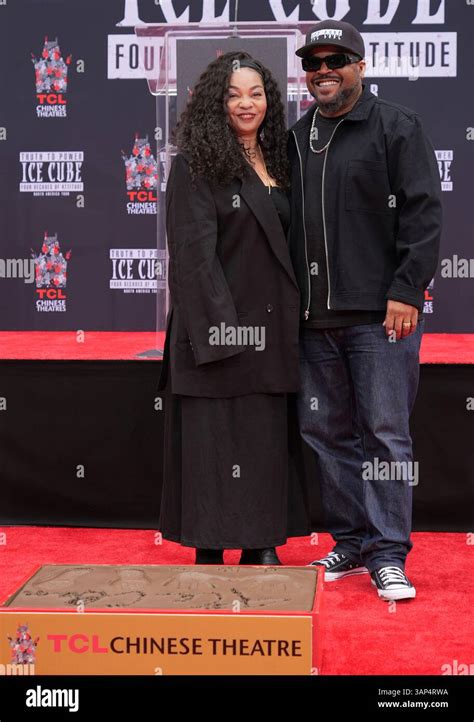Ice Cube Right And His Wife Kimberly Woodruff Pose Together During A