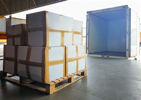 package boxes stack on pallets loading into cargo trucks supply chain