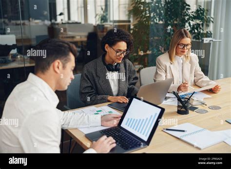 Businesspeople Working Together On New Project In Modern Office