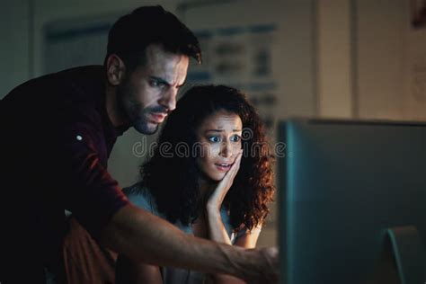 Please Tell Me You Can Fix This Two Colleagues Using A Computer Together During A Late Night At