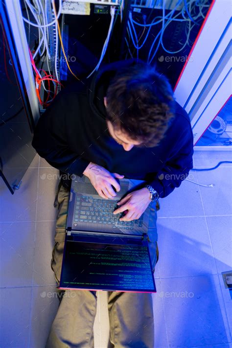 Focused Hacker In Data Center Hacking Software System Vulnerable Cyber