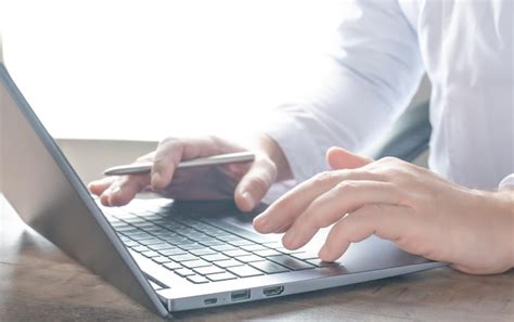 Premium Photo Man Hands Typing Keyboard Laptop Project Manager Researching Process Digital