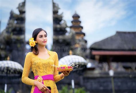 Indonesian Girl With Traditional Costumn Dance In Bali Temple Stock