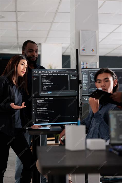 Premium Photo Diverse Database Developers Discussing About Html Code