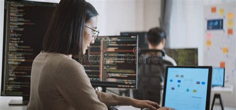 Asian Male Female Software Developer Coding Program On Desktop Computer Man Woman Work From