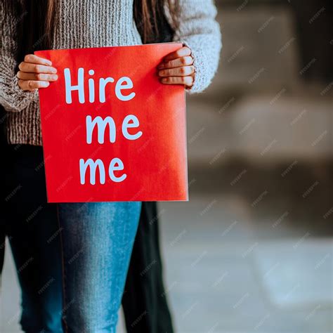 A Woman Holding A Sign That Says Get Me Me Me Me Me Me Me Me Me