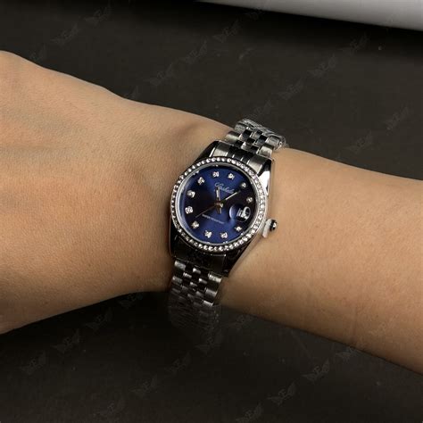 ساعت مچی دخترانه عقربه دار نگین دار نقره ای طلایی ارن شاپ