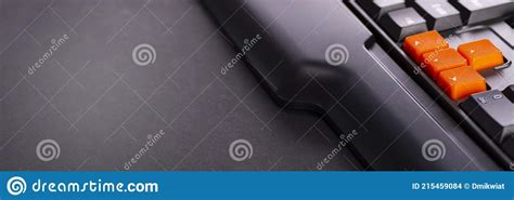 Orange Arrow Keys On A Black Keyboard Up Down Left Right Buttons On A Gaming Computer