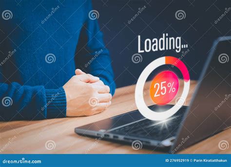 Young Man Using A Laptop Computer For Download Software And Waiting To Loading Digital Business