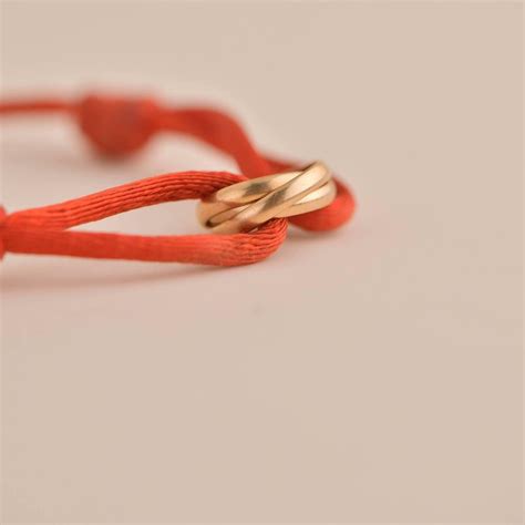 Cartier Trinity 18k Rose Gold Orange Cord Bracelet For Sale At 1stdibs