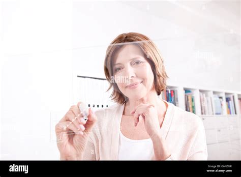 Woman Using Transparent Touchscreen Display Stock Photo Alamy