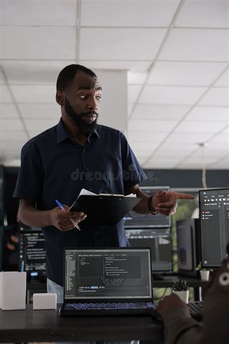 African American Web Developer Analyzing Html Script On Terminal Window