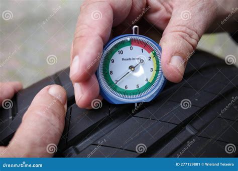 Measuring The Tread Depth Of A Tire Stock Photo CartoonDealer Com 160817250