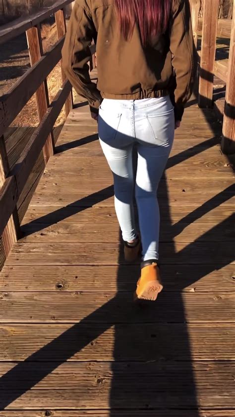 Casually Wetting Jeans Outdoors