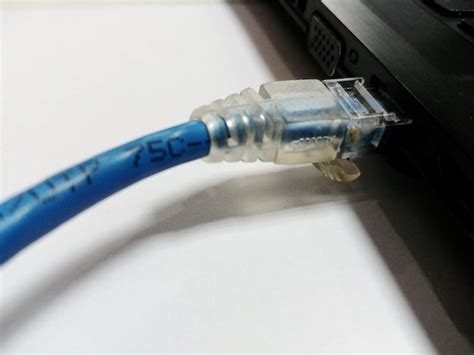 Premium Photo Close Up Of Usb Cable Connected To Laptop On Table