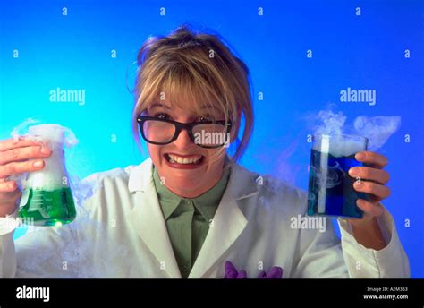 Portrait Of A Mad Female Scientist Holding Beakers With Colored Stock Photo Alamy