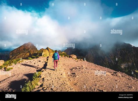 Description Woman Hiking Along Scenic Hike Trail To Pico Ruivo In The