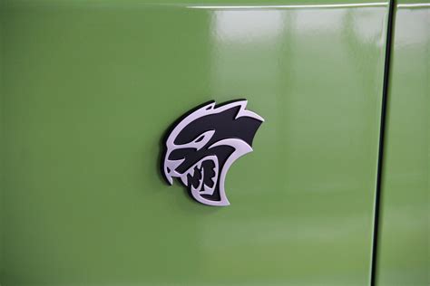 Dodge Challenger Srt Hellcat Emblem On Green Car