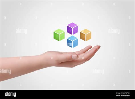 Hand Holding Levitating Blockchain Cubes With Binary Code Symbolizing