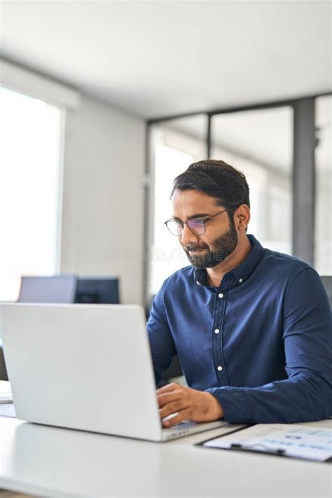 Busy Indian Professional Business Man Employee Using Laptop Working In
