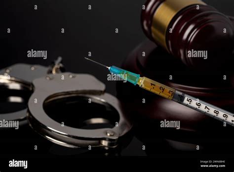 Syringe With Gavel And Handcuffs Lethal Injection Death Penalty And