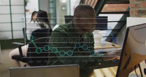Animation Of Graph Over African American Man Working On Computer In Office Stock Video Video