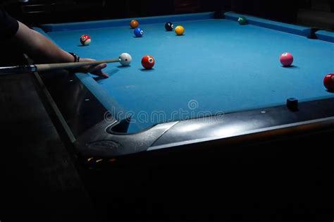 The Hand Holding The Billiard Cue Ready To Make A Precise Strike On