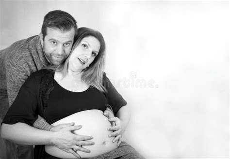 Eight Months Pregnant Woman And Dad Hugging Her Stock Photo Image Of Pregnancy Adult