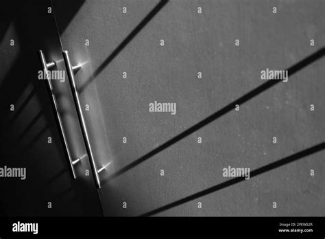 Metal Door In Wall Grayscale Shadows From Window Monochrome Stock