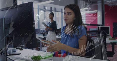 Image Of Data Processing Over Caucasian Woman With Document Looking At Computer Screen Stock