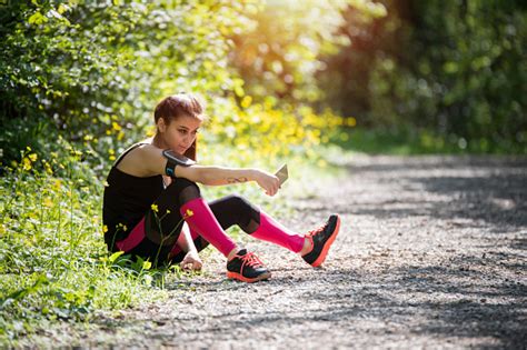 Indian Woman Resting In The Forest After Jogging And Making A Selfie