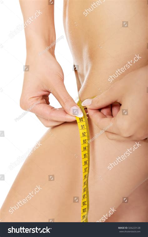 Naked Woman Measuring Her Body Isolated Shutterstock