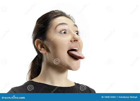 Smiling Girl Opening Her Mouth And Showing The Long Big Giant Tongue