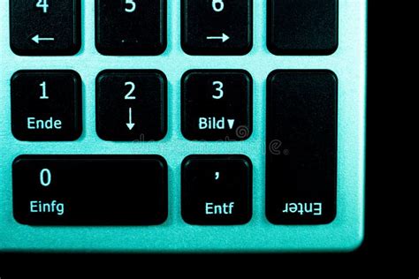 close up view of computer keyboard with upside down enter key or button