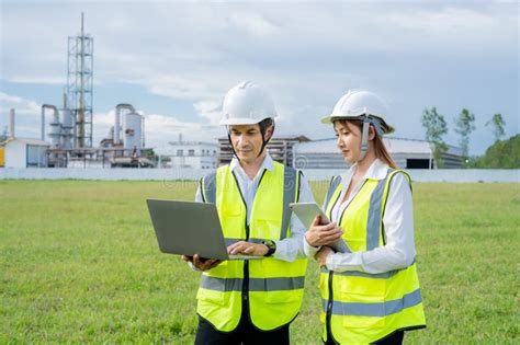 Asian Male And Female Engineers Looking Stock Image Image Of Asian Vehicle 336695077
