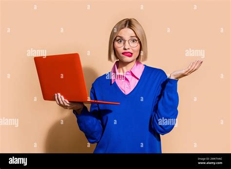 Portrait Of Worried Clueless Programmer Hold Wireless Laptop Bite Lips