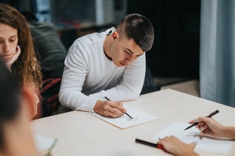 Students Focused On Drawing In A Collaborative Classroom Environment