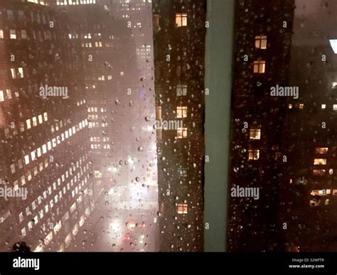 Looking Out A Apartment Casement Window In Midtown Manhattan During A